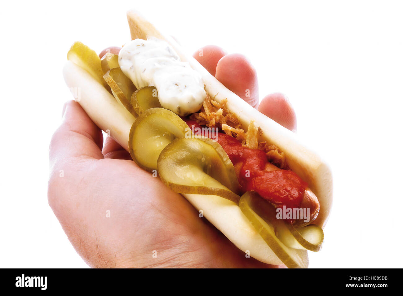 Hand holding a Hot Dog Stock Photo - Alamy
