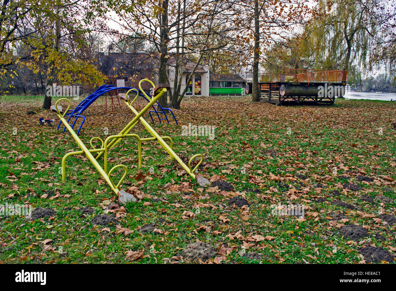 An empty playground on the bank of the river in autumn Stock Photo - Alamy