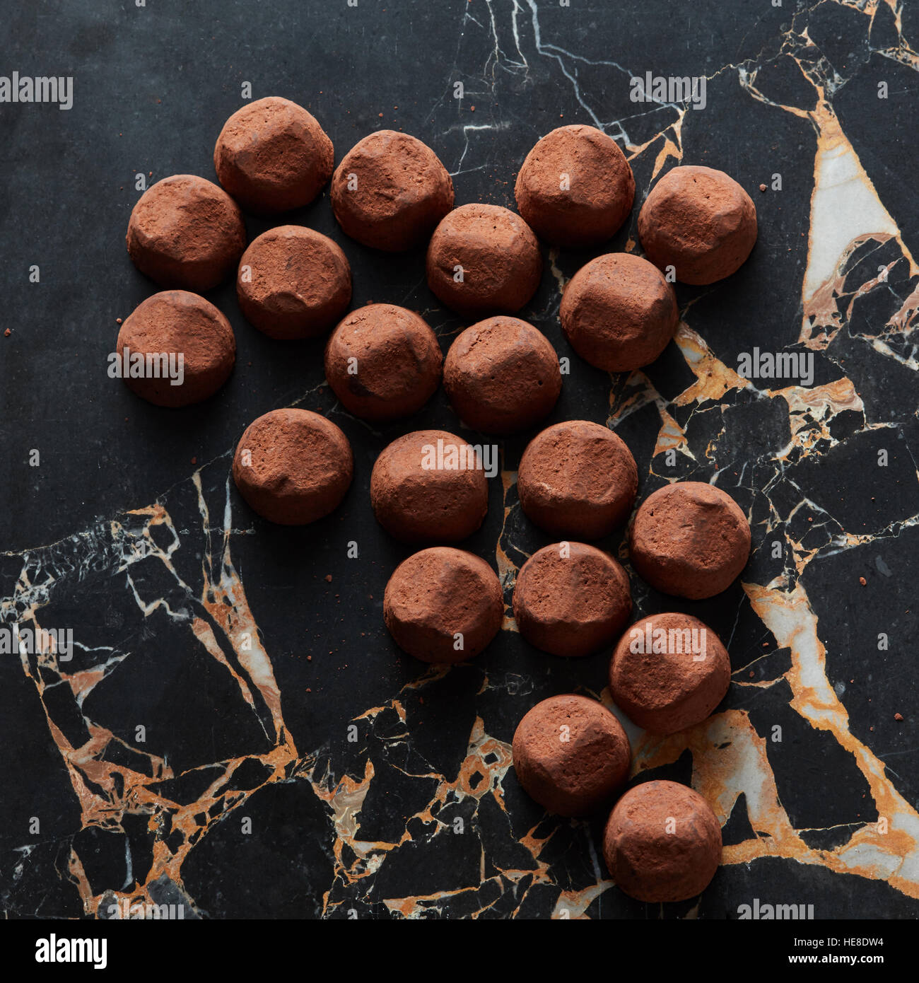 delicious chocolate truffles on a dark marble background Stock Photo ...