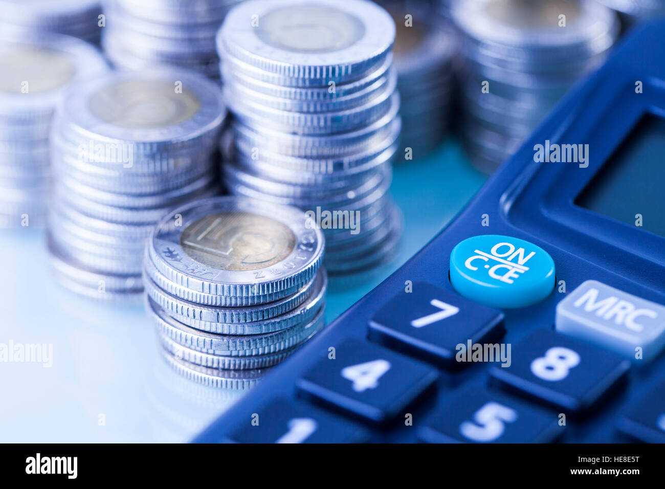 counting income, pile of money, calculator in white background Stock ...