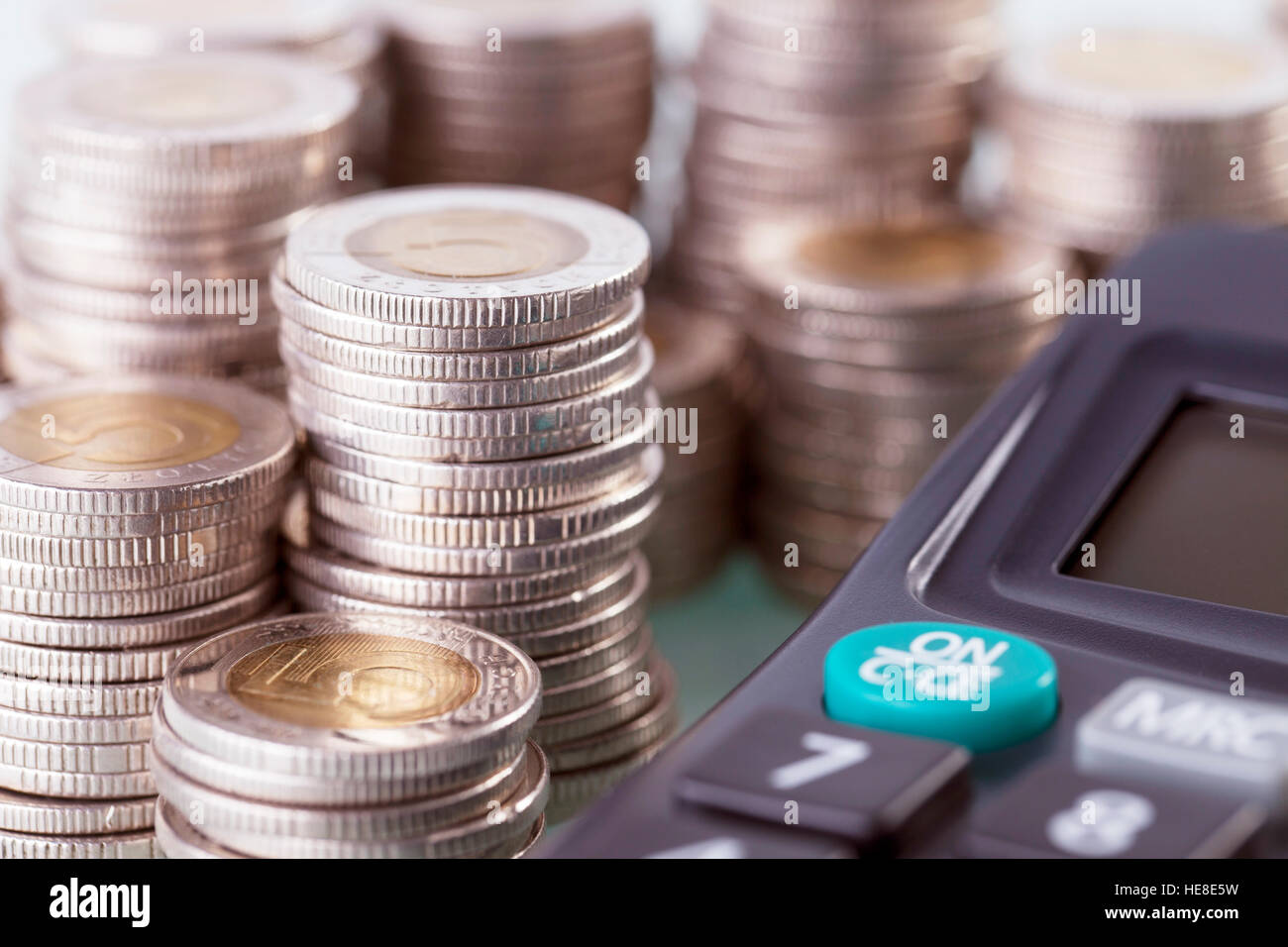 counting income, pile of money, calculator in white background Stock ...
