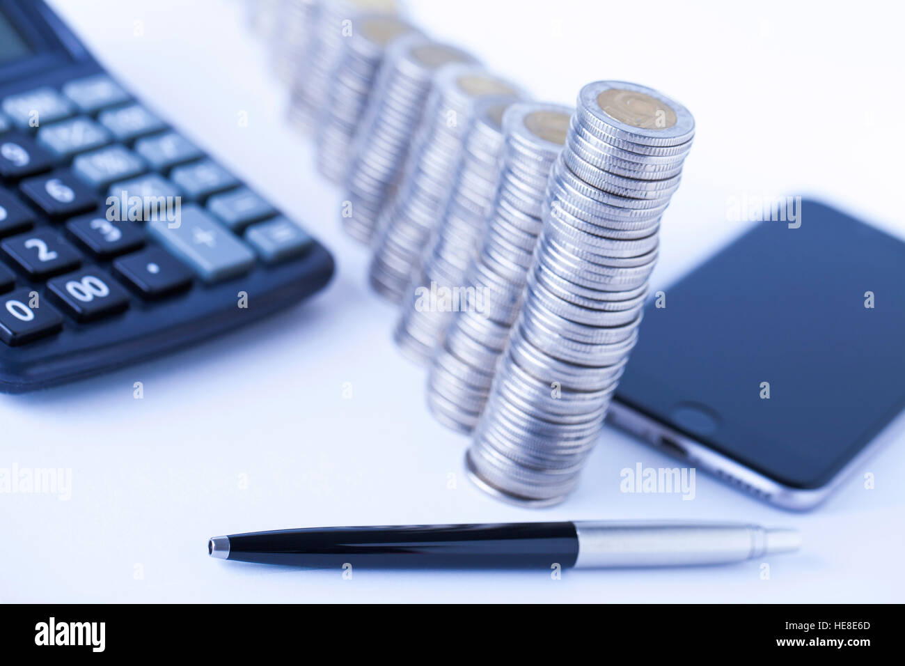 counting income, pile of money, calculator in white background Stock ...