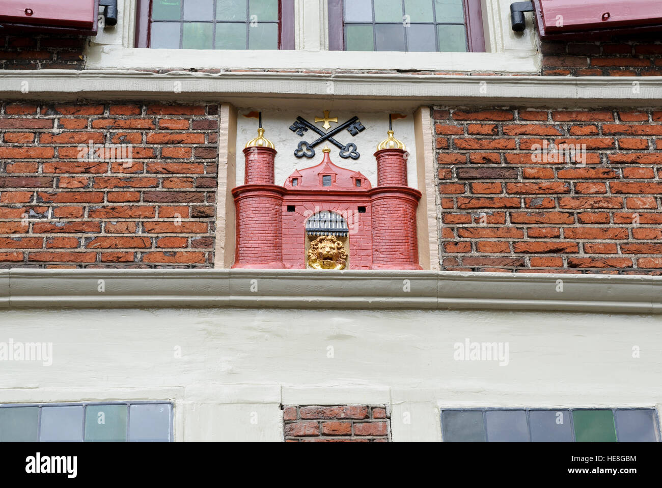 A bas relief of a castle on the exterior wall of a building in ...