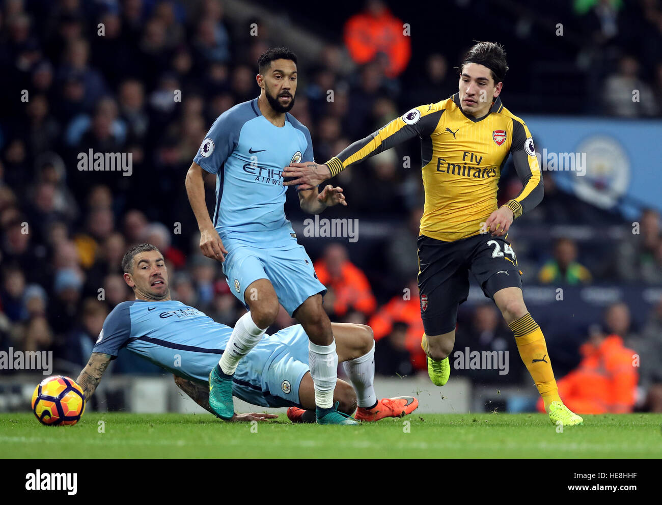 Arsenal's Hector Bellerin (right) gets past Manchester City's ...