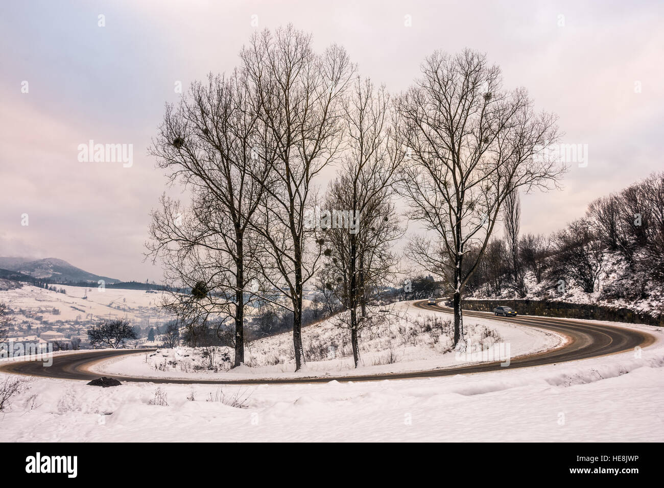 empty winding mountain road on a hillside in winter Stock Photo - Alamy