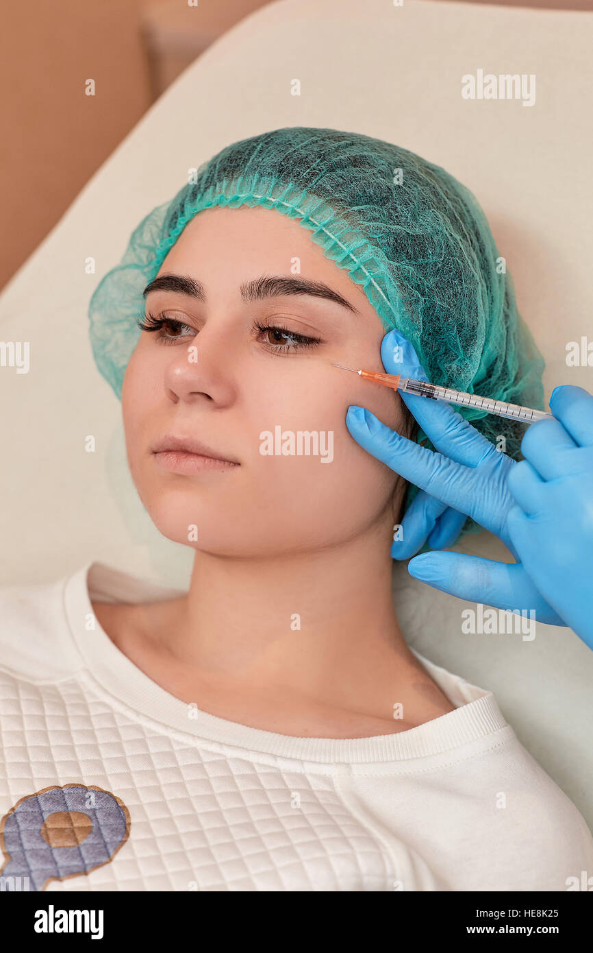 Beautiful woman gets injections Stock Photo - Alamy