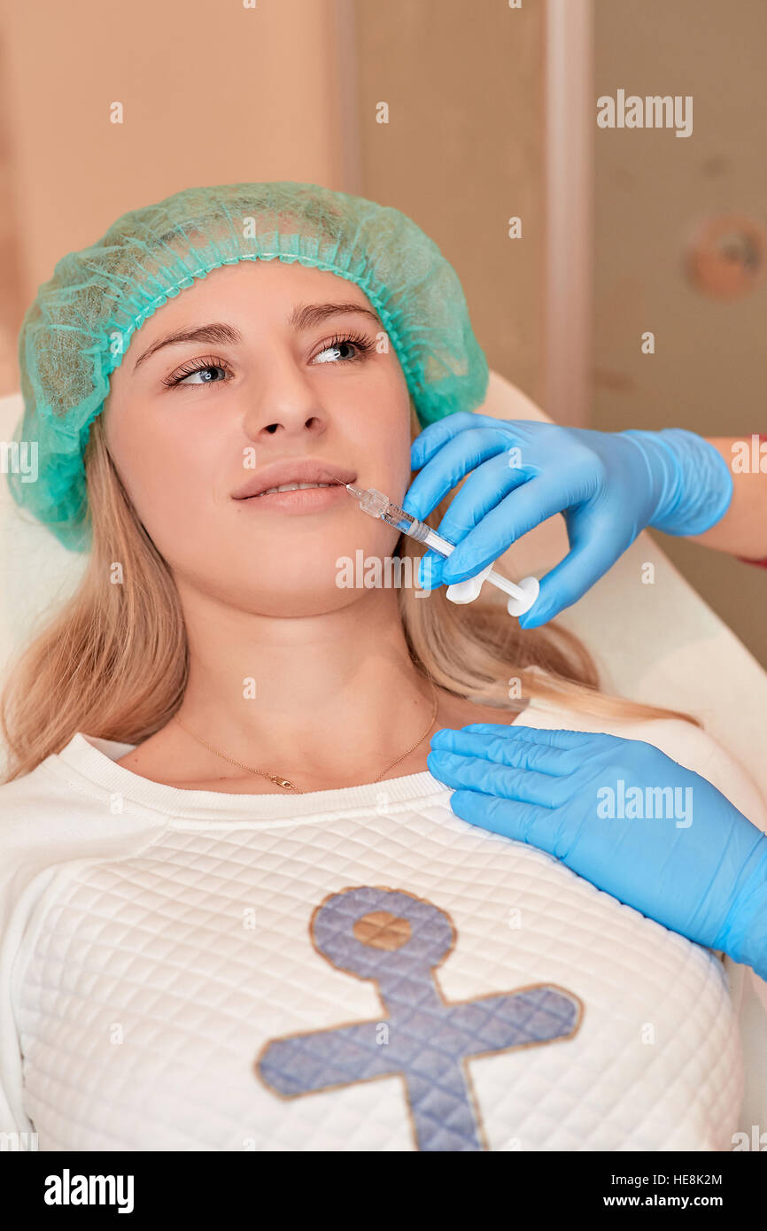 Closeup of beautiful woman gets injection in her lips Stock Photo - Alamy