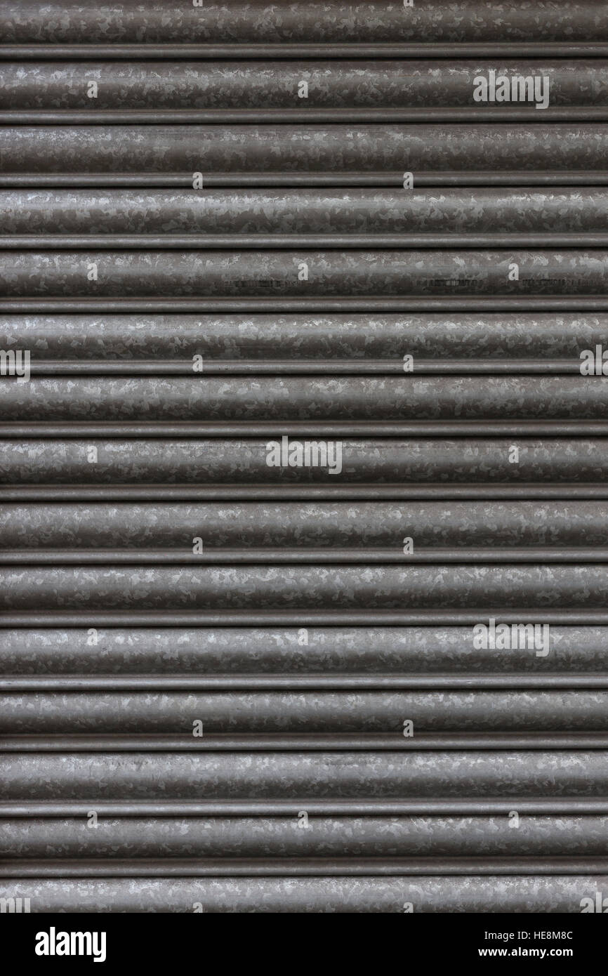 Grey steel functional security shutter Stock Photo - Alamy