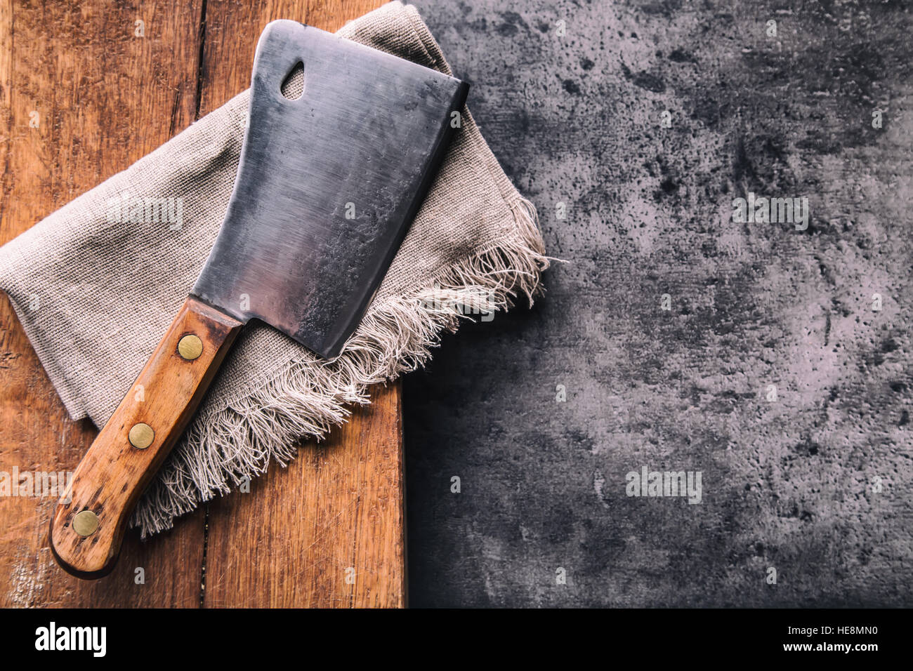 Butcher. Vintage butcher meat cleavers with cloth towel on dark ...