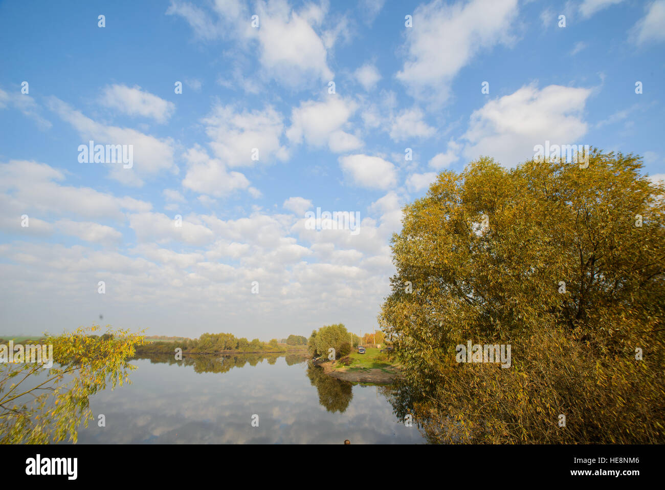lake morning in autumn and the running of alloca in the sky Stock Photo ...