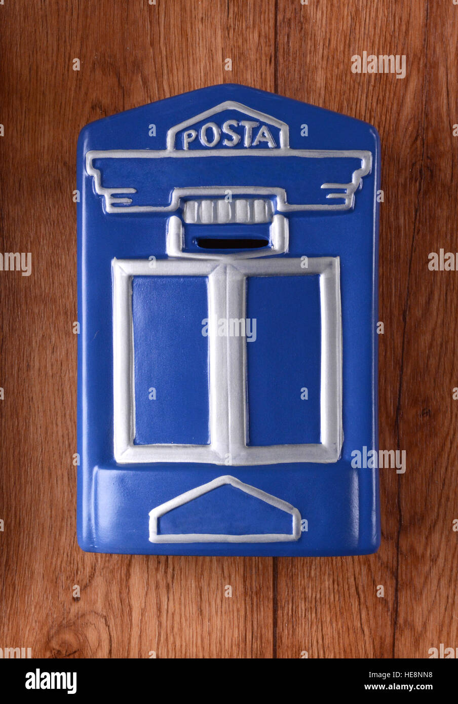 Blue post box on wooden wall Stock Photo - Alamy