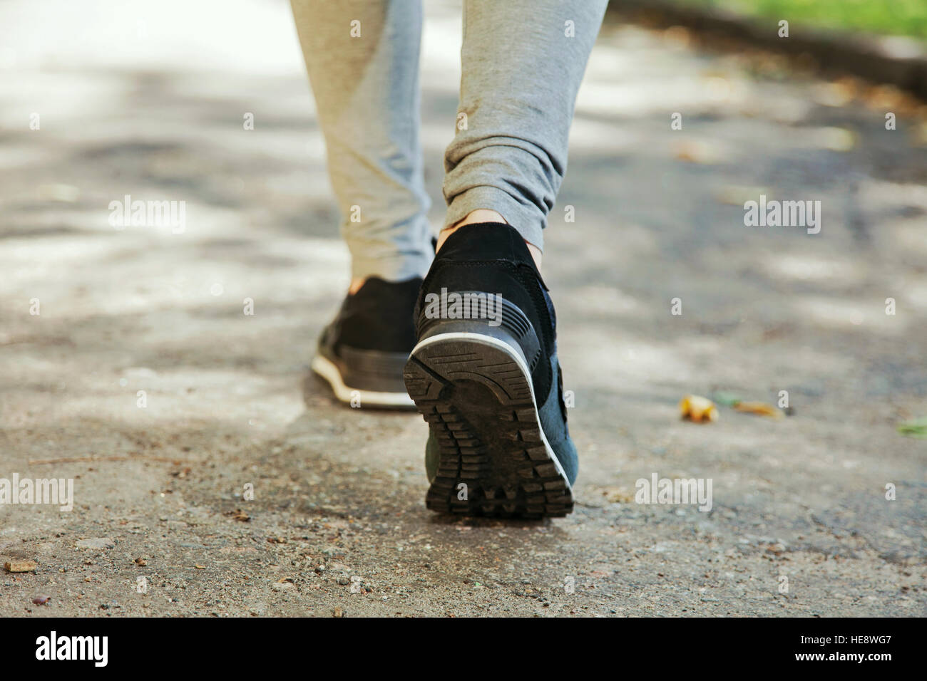 Closeup female running shoes on the feet Stock Photo - Alamy