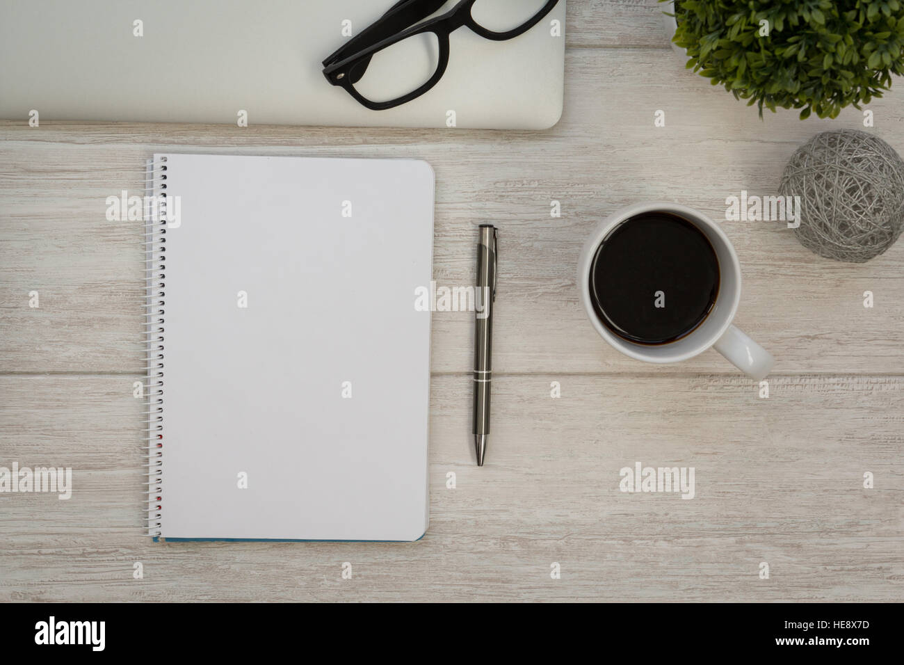 Business desktop objects on a grey wooden background Stock Photo - Alamy