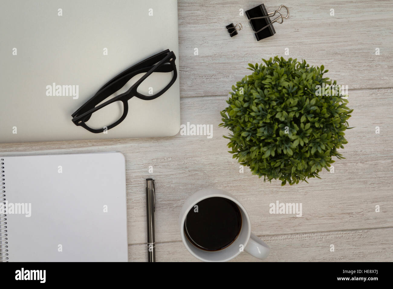 Business desktop objects on a grey wooden background Stock Photo - Alamy
