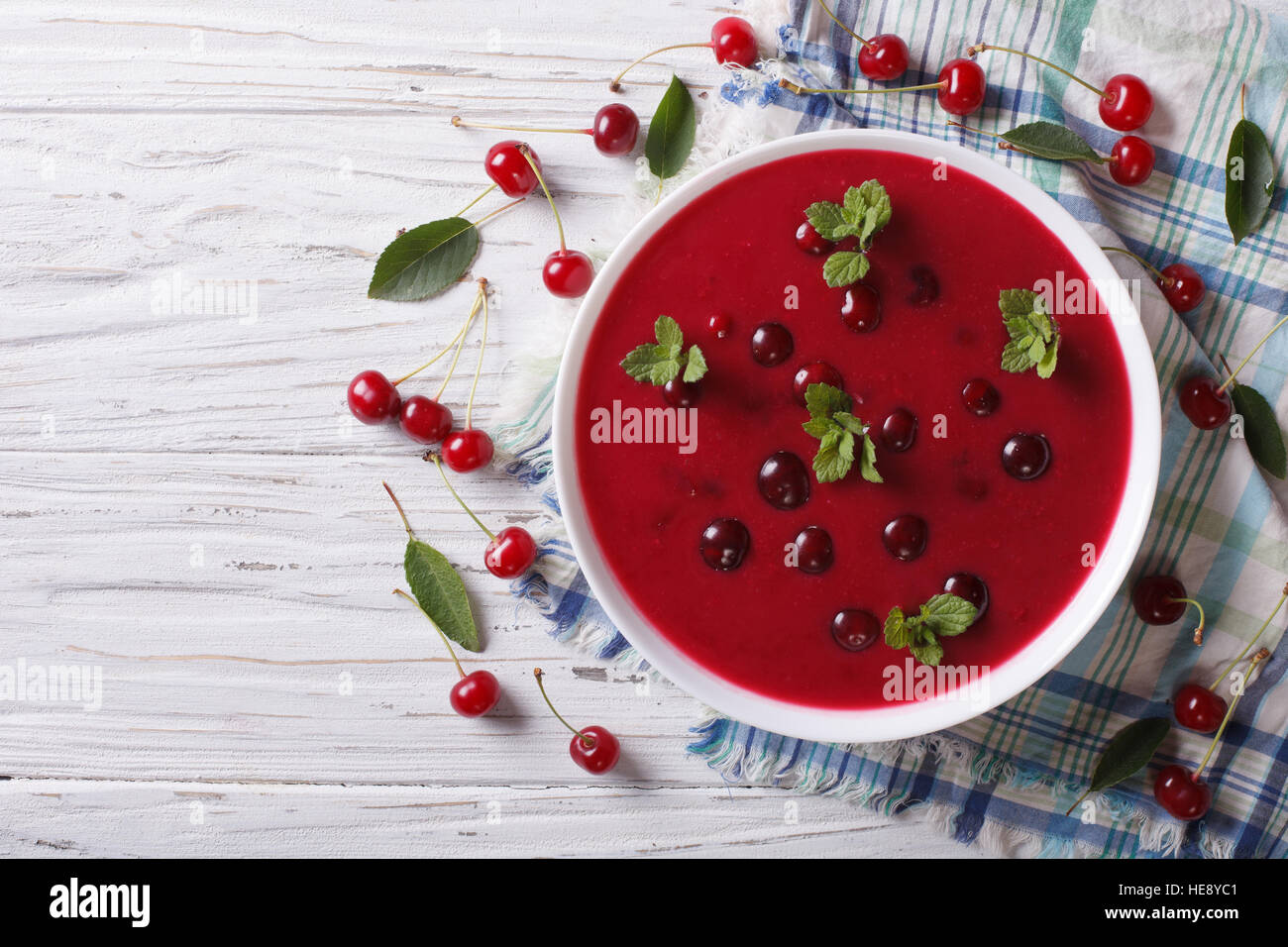 Hungarian cold cherry soup on the table. horizontal view from above ...
