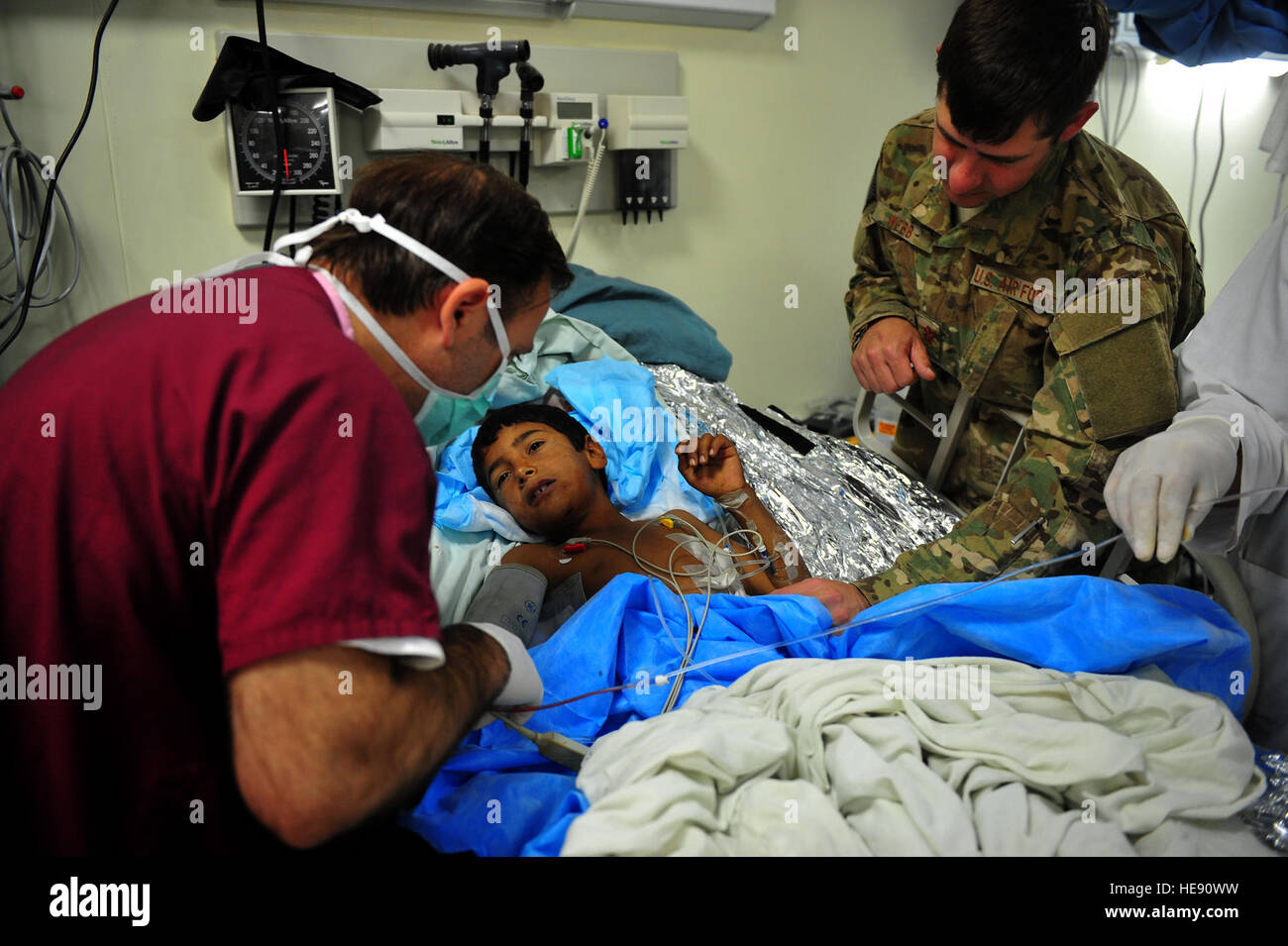 Air Force Major Jason Webb advises an Afghanistan doctor, during the ...