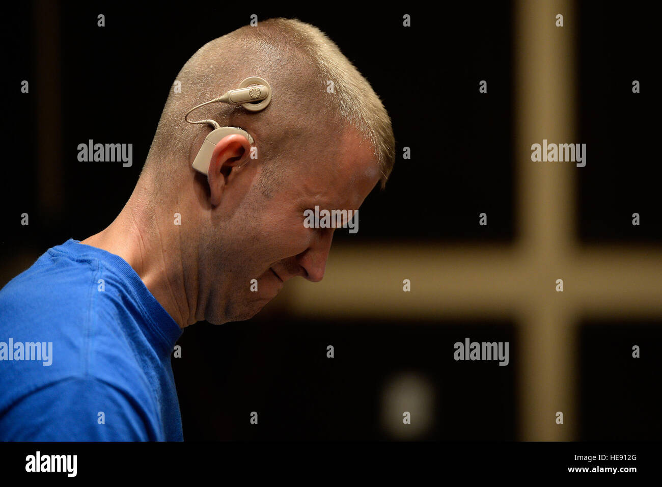 Jeremiah Means, Wounded Warrior athlete, conducts an evaluation for ...