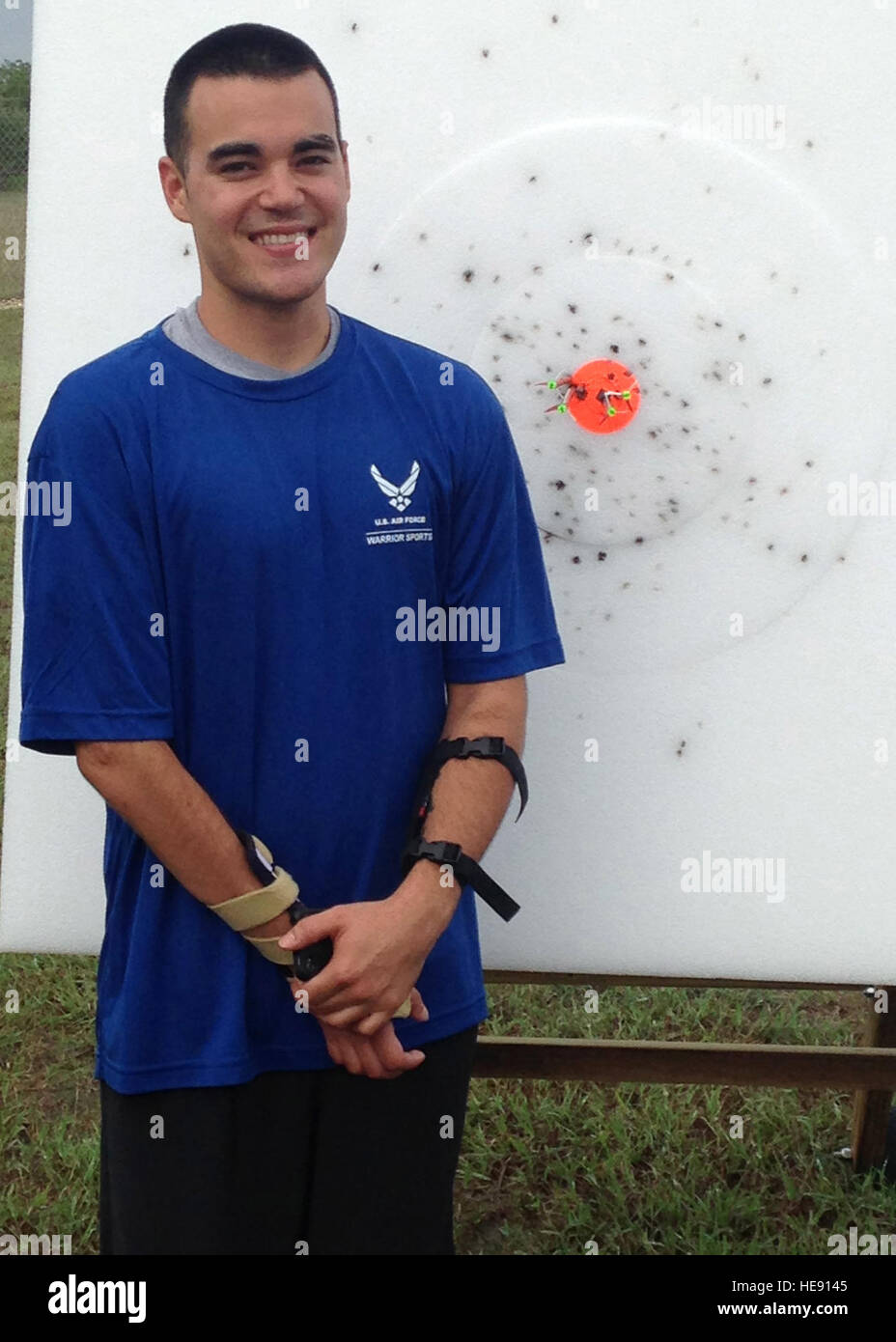 Staff Sgt. Daniel Crane poses next to a grouping of his arrows during ...