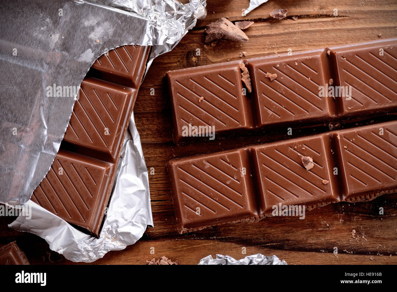 the chocolate bar on the wooden table Stock Photo - Alamy