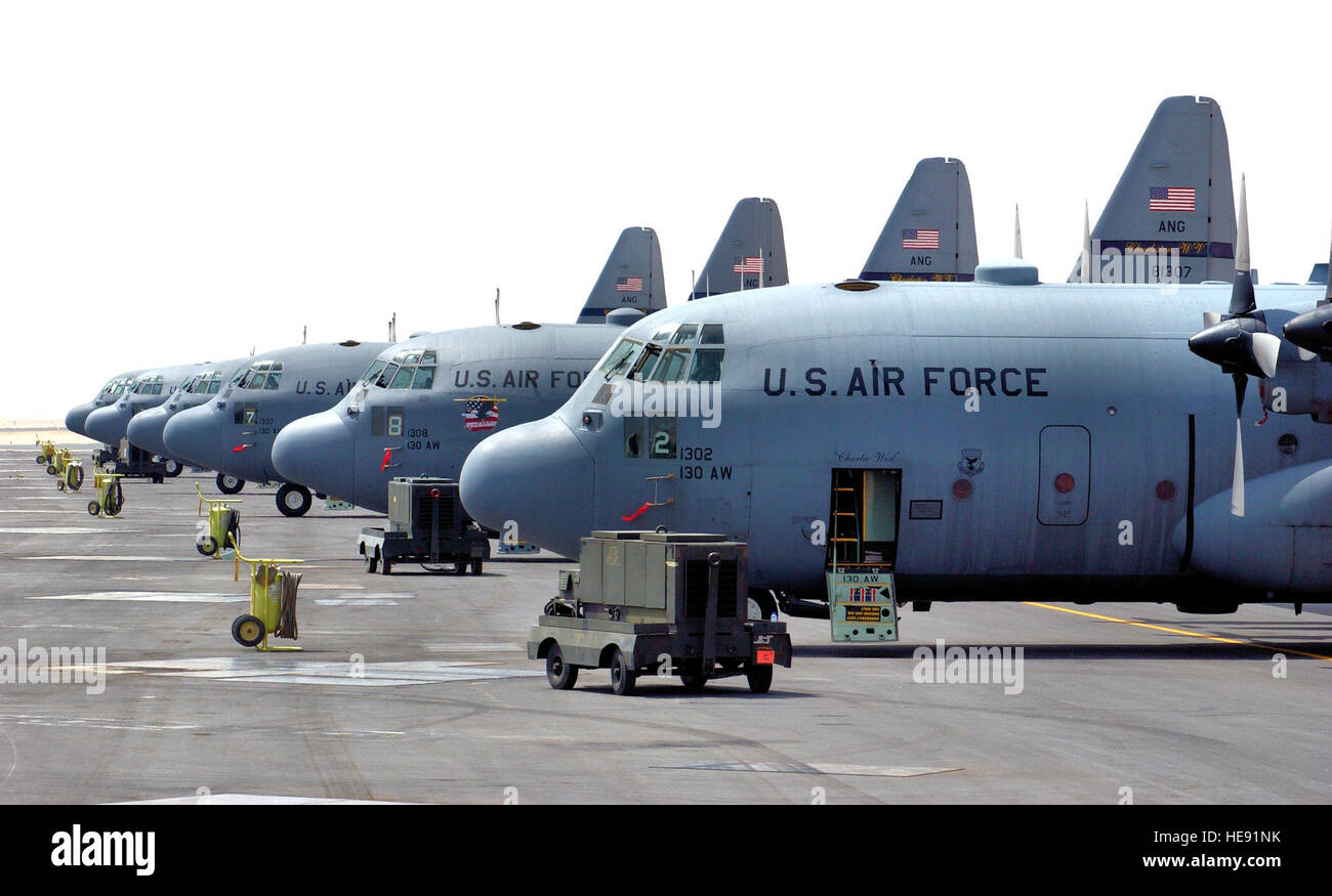 OPERATION IRAQI FREEDOM -- C-130 Hercules sit on the ramp at a forward ...