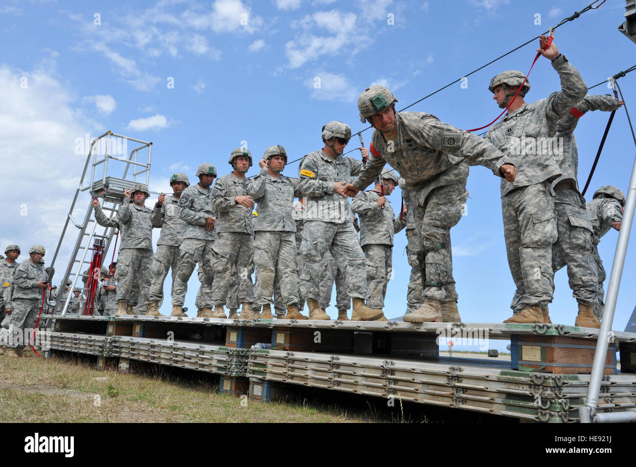 U.S. Army Sgt. 1st Class Brian Boisvert, (2nd from right), jump master ...