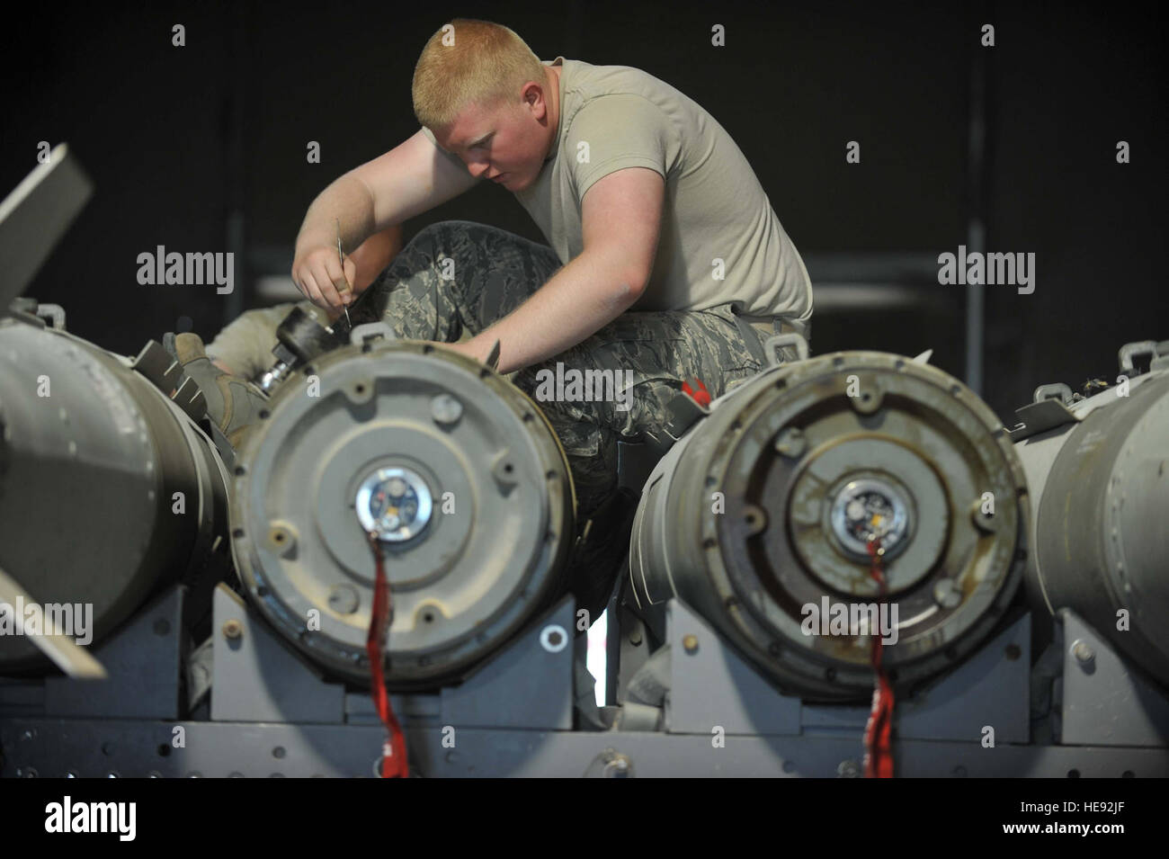 Airman 1st Class Connor Howard removes a bomb fuze initiator (FZU-55 ...
