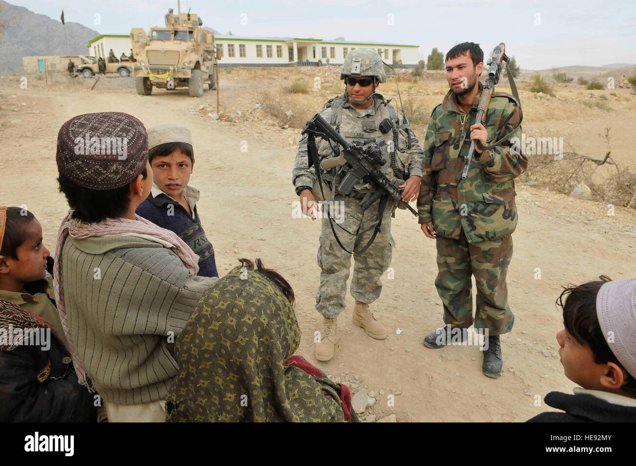 U.S. and Afghan national army soldiers conduct a combined security ...
