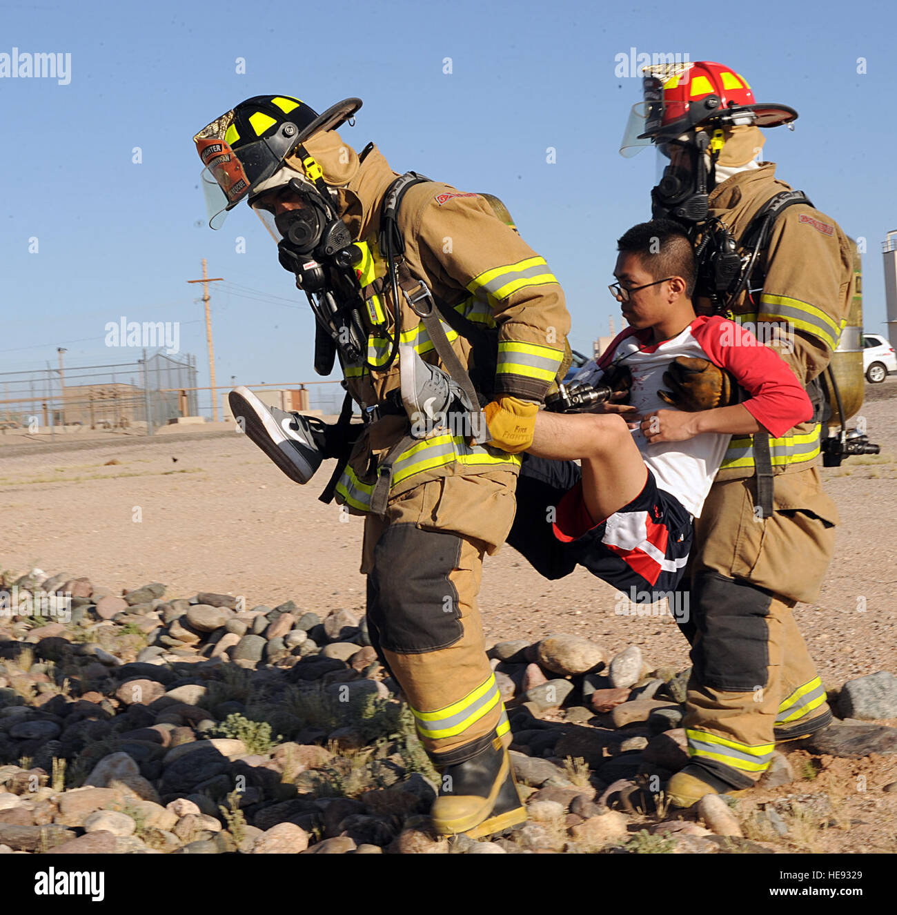 Firefighters from the 355th Civil Engineer Squadron carry an Airman ...