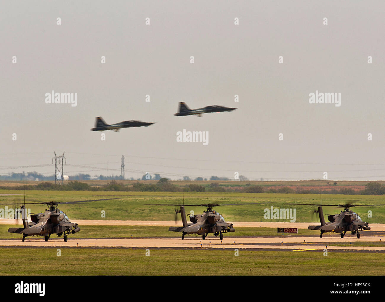 Three U.S. Army AH 64 Delta Apache helicopters depart after a fuel stop ...