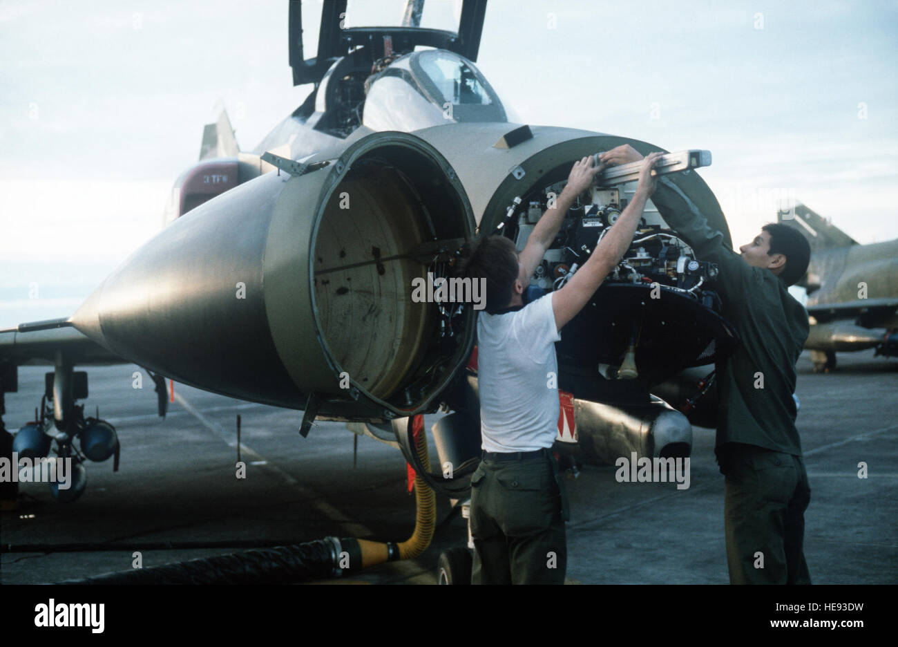 Ground crewmen perform maintenance on the radar system of a 3rd ...