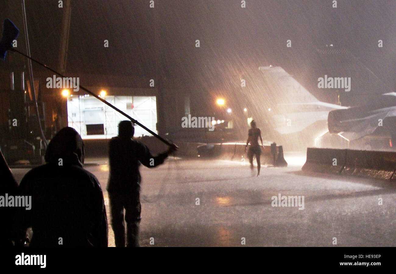 Under artificial rain, an actress with the WB's Mercy Reef pilot enters ...
