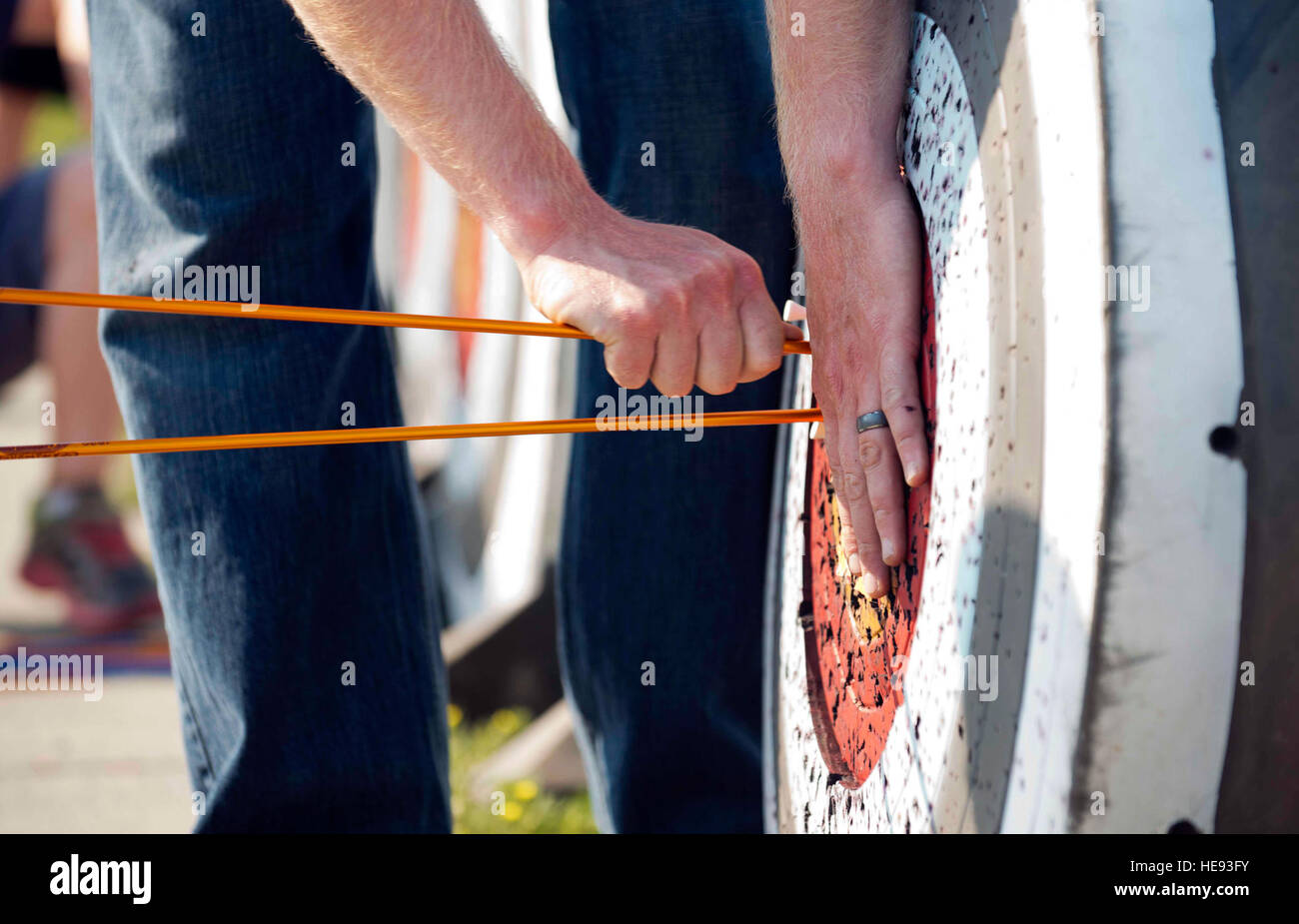 Tech. Sgt. Jarod Cappon, archery instructor, removes an arrow from a ...