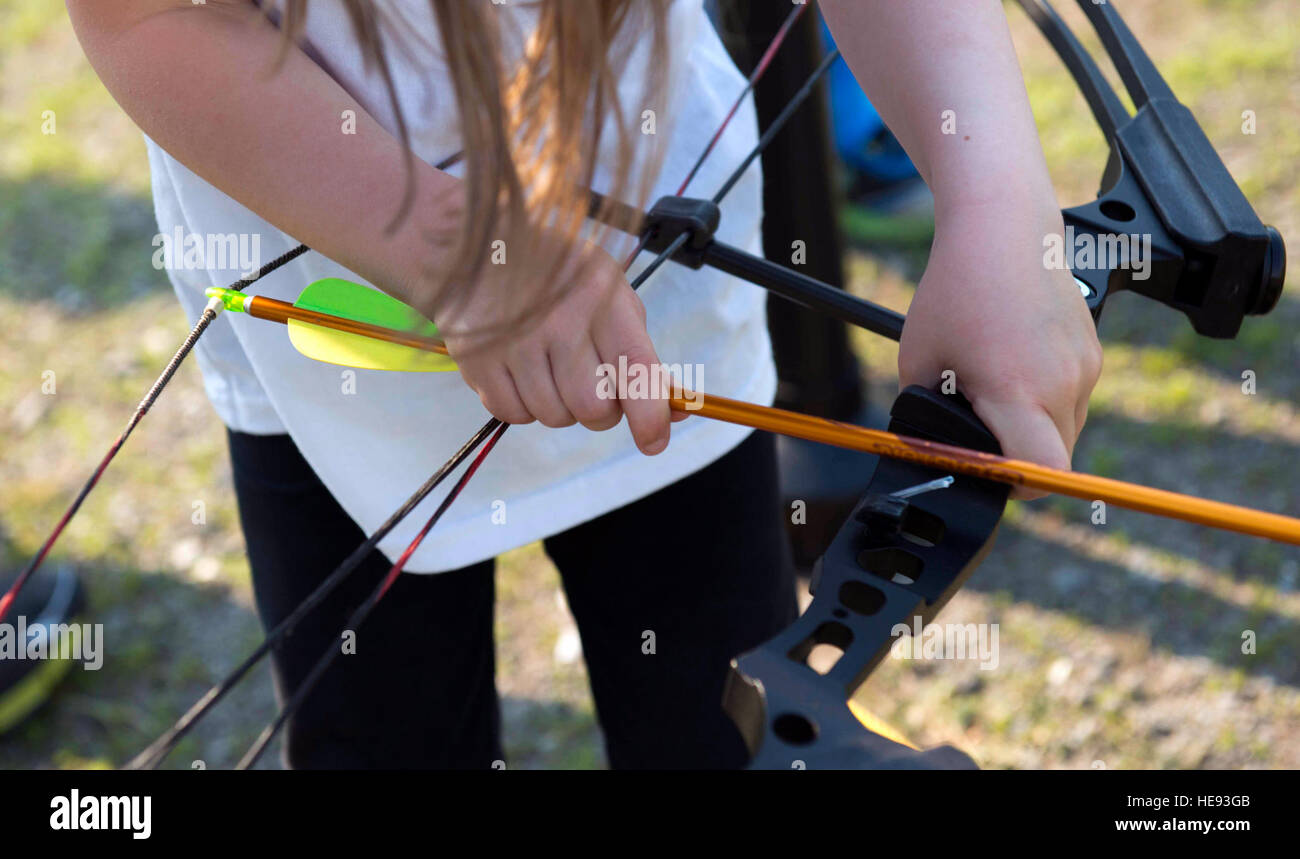 Josephine Condrey, 6, lays an arrow on the arrow rest during an archery ...