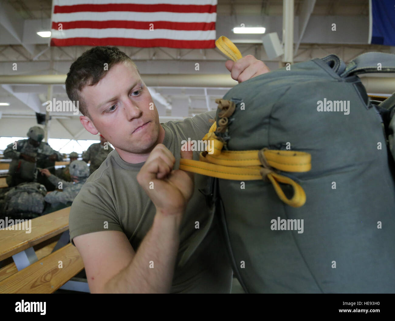 A jumpmaster inspects paratroopers and equipment at Joint Base ...