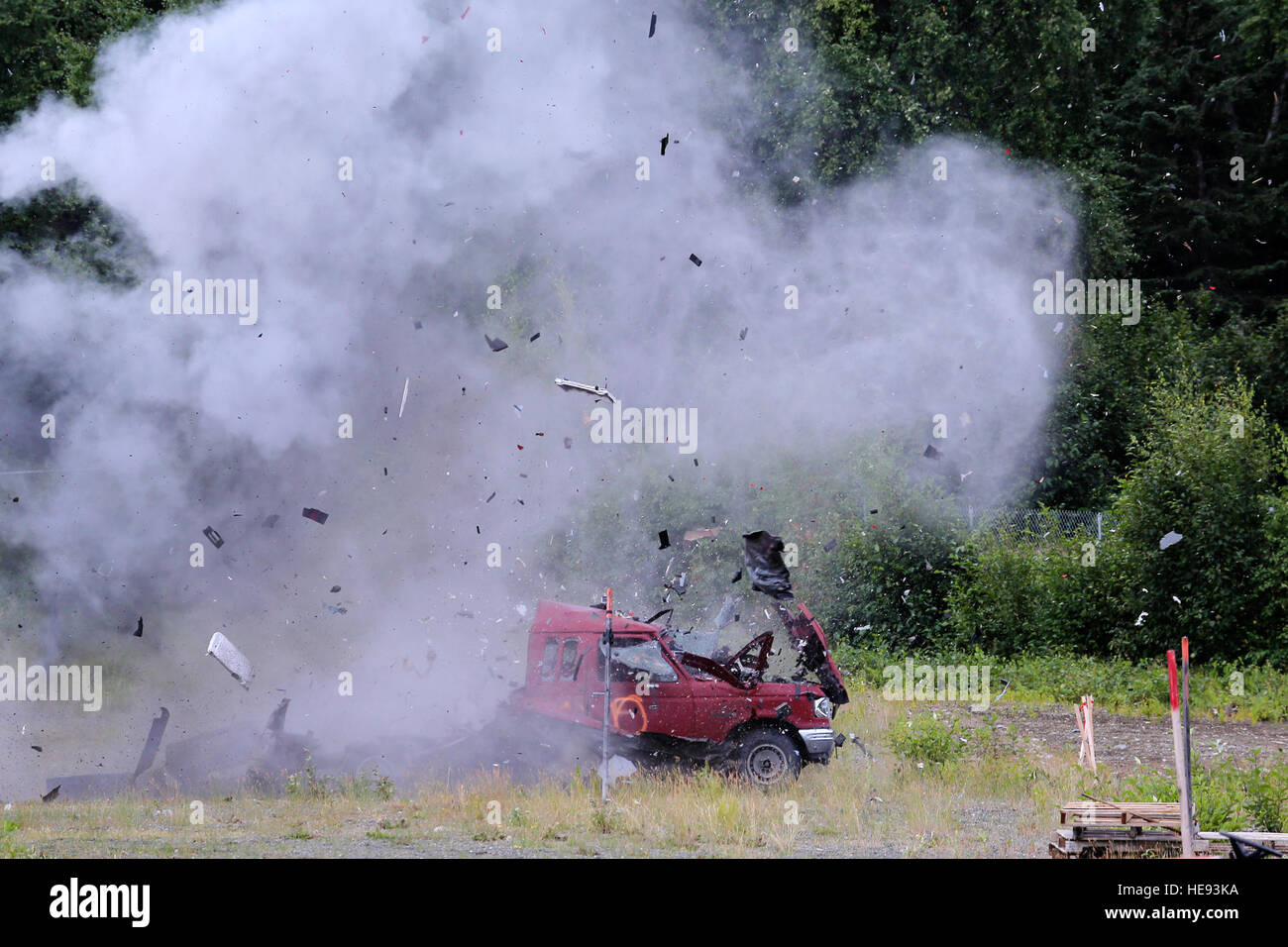 An explosive device is control-detonated to demonstrate the blast ...
