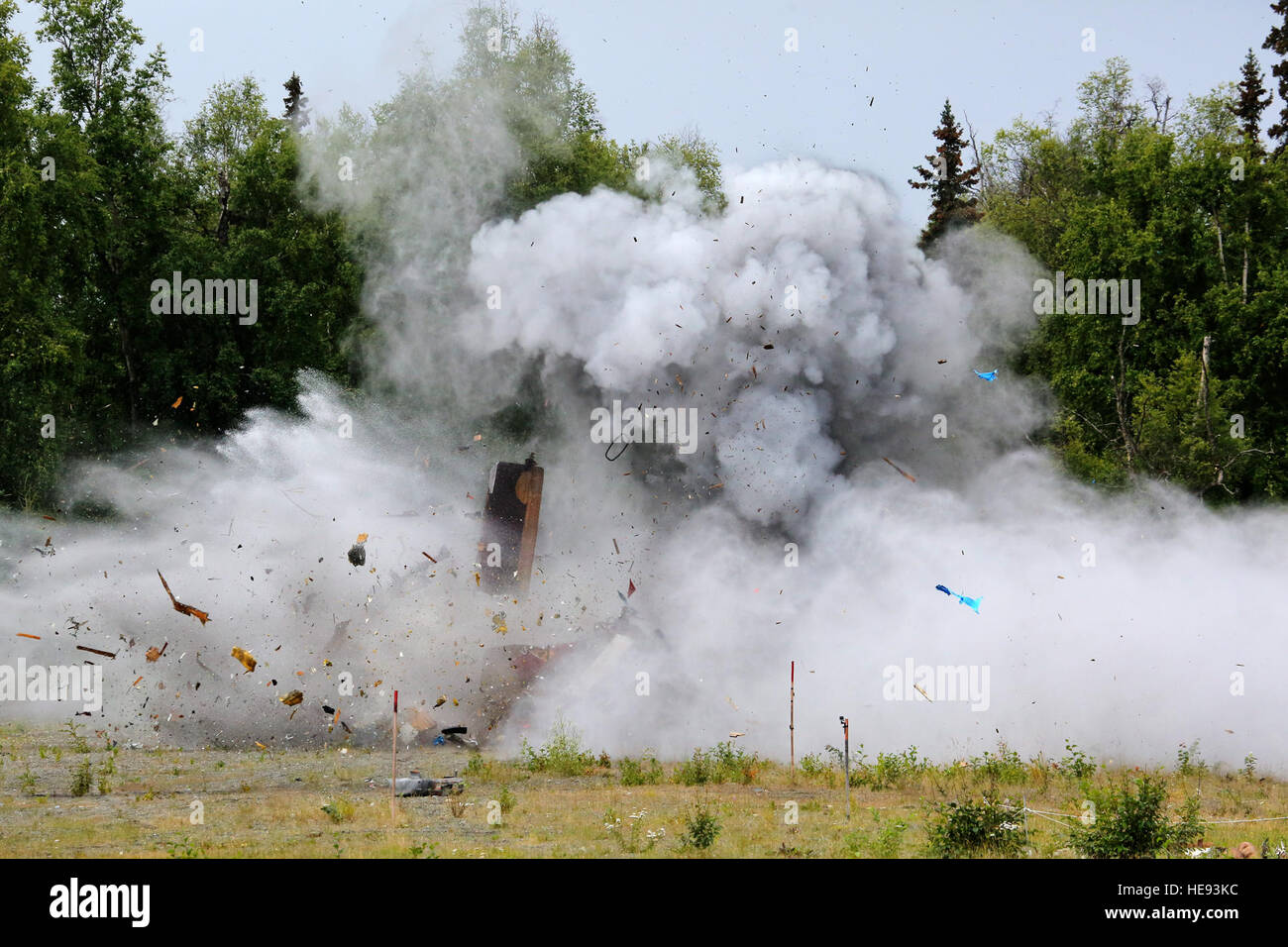 An explosive device is control-detonated to demonstrate the blast ...