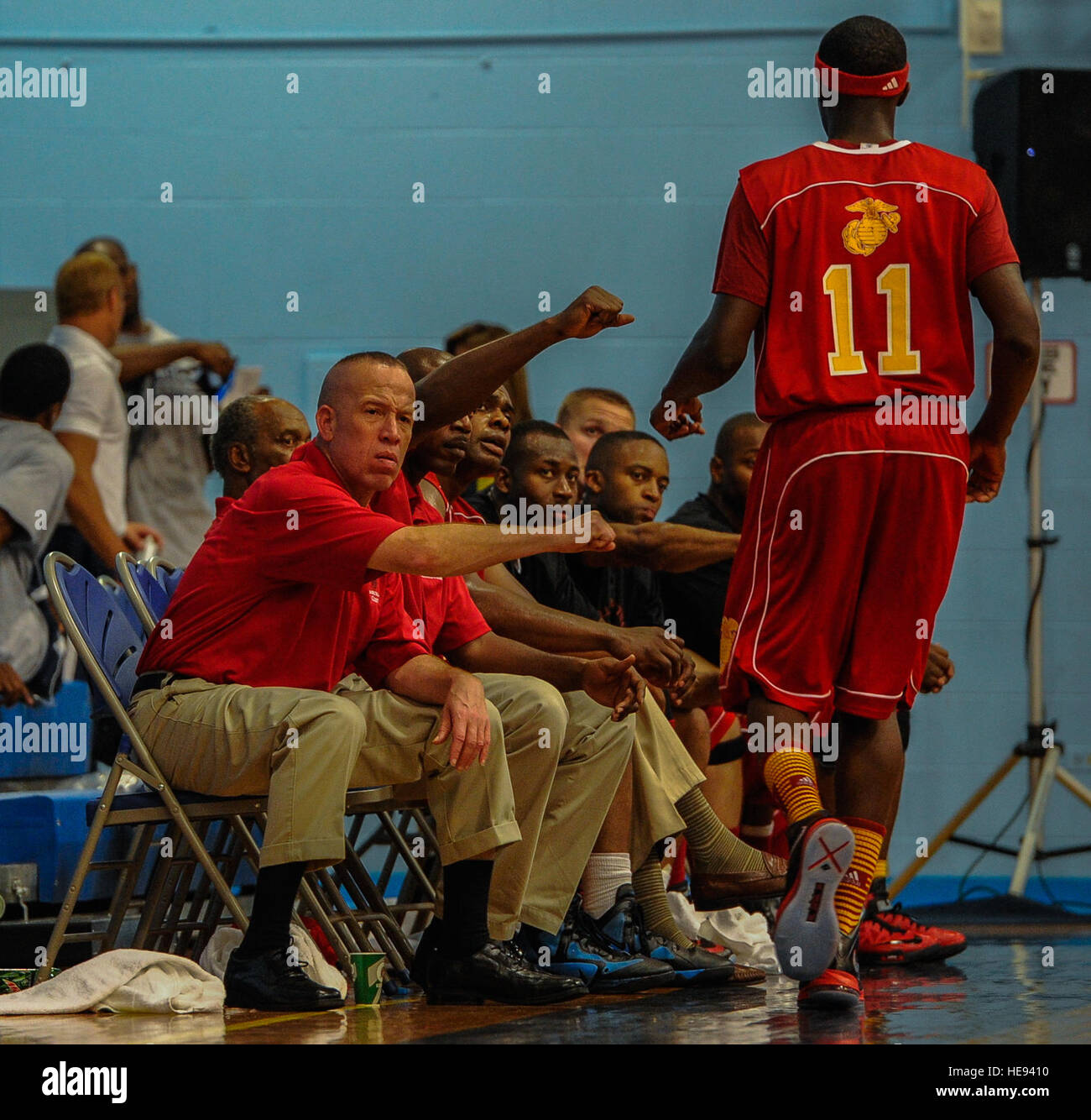 All-Marine Corps basketball team Head Coach James A. Jones bumps fists ...