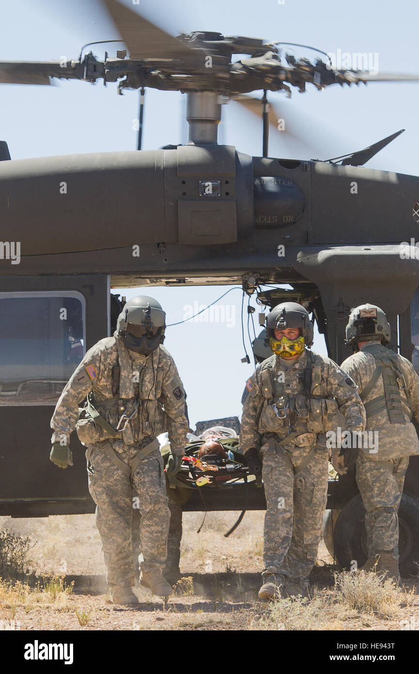 U.S. Army Sgt. Nathan McGlaughlin, a crew chief, and Evan Newkirk, a ...