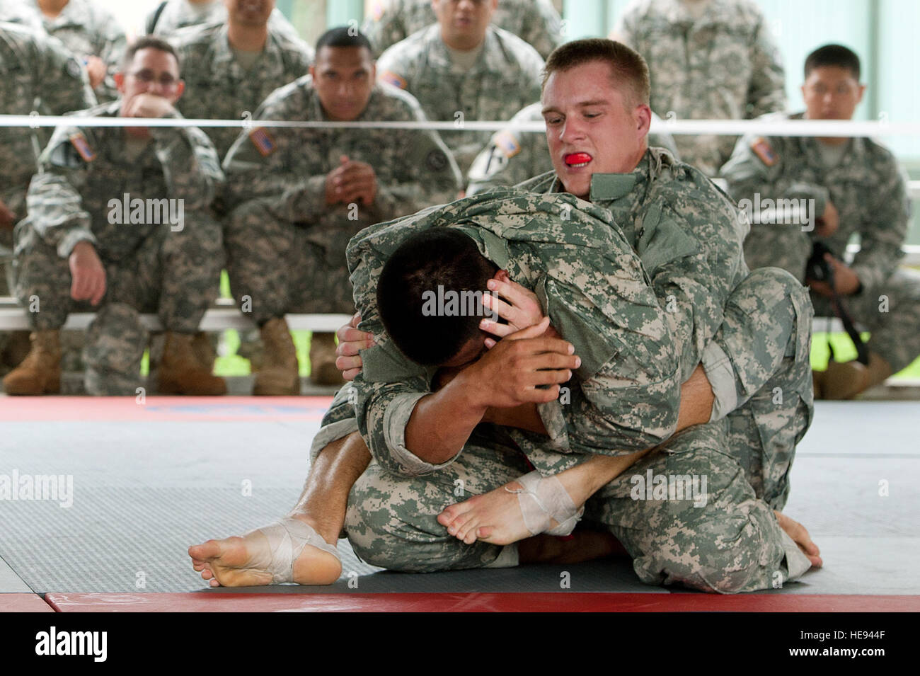 A U.S. Army fire support specialist participates in the combatives ...