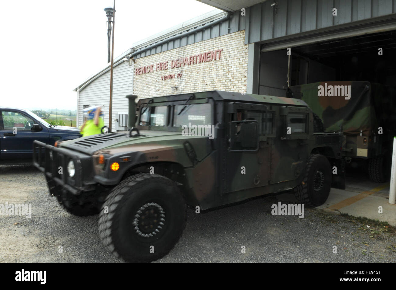 Members of the West Virginia Army National Guard position a Humvee to ...