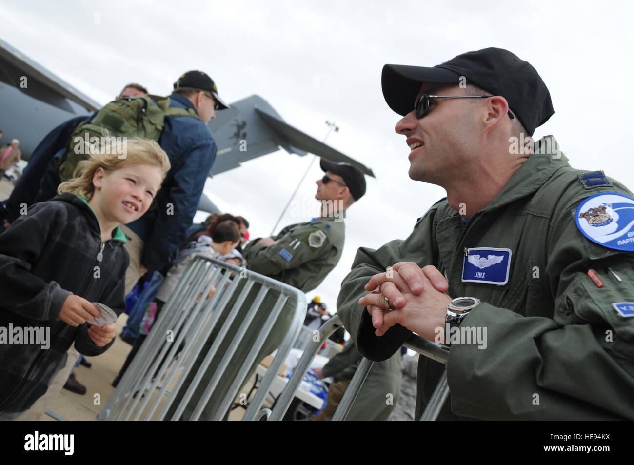 GEELONG, Australia - A young Australian fan of the F-22 Raptor looks up ...