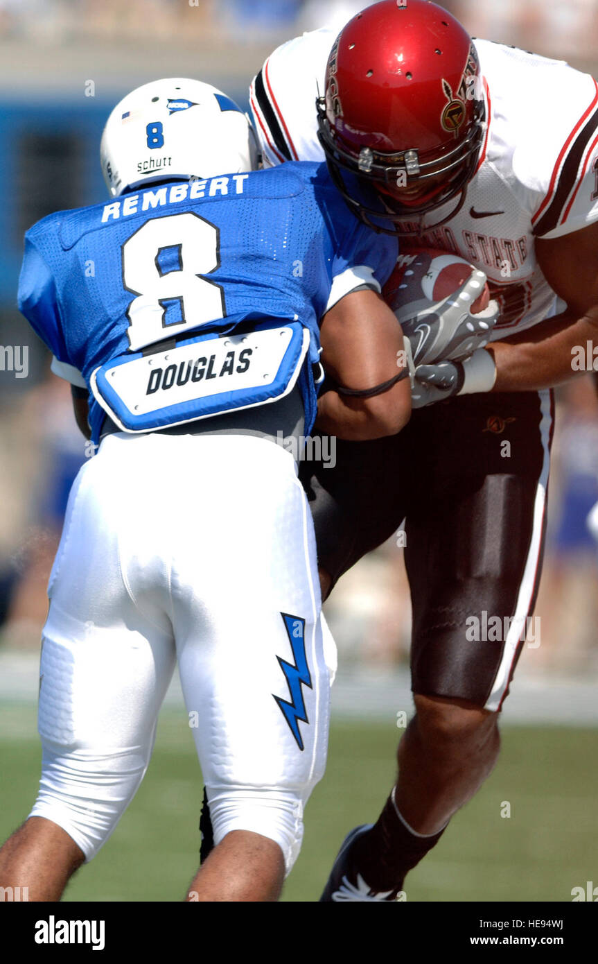 U.S. Air Force Academy junior defensive back Reggie Rembert tackles a ...