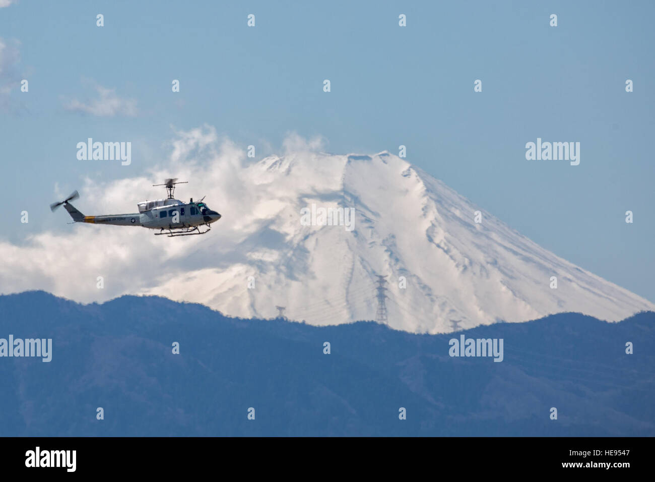 A UH-1N Iroquois with the 459th Airlift Squadron flies over Yokota Air ...