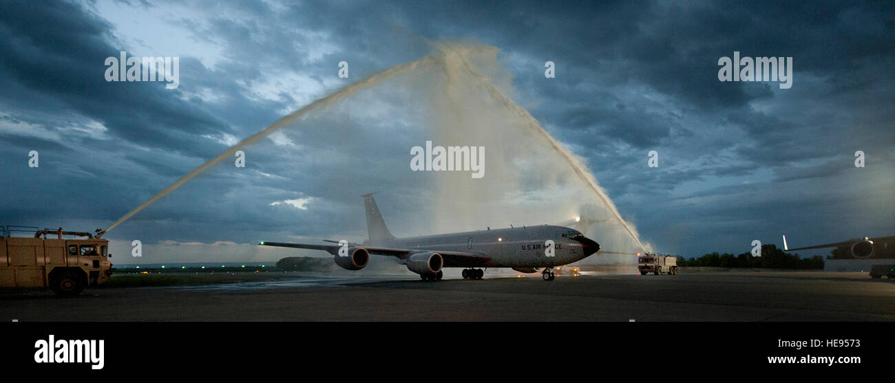 Fire trucks spray water over a KC-135 Stratotanker during the final ...