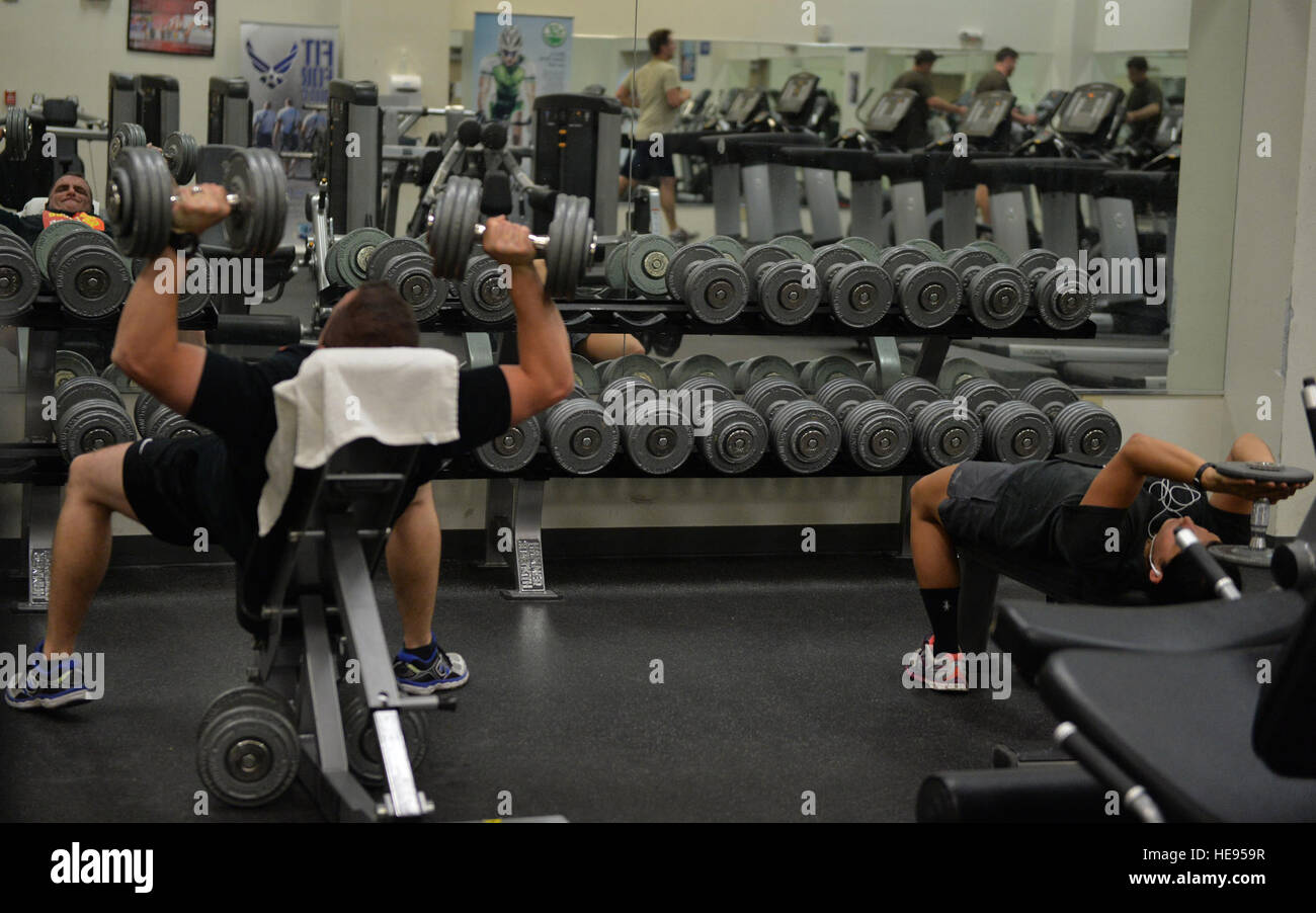 Airmen of the 432nd Wing/ 432nd Air Expeditionary Wing lift weights to ...