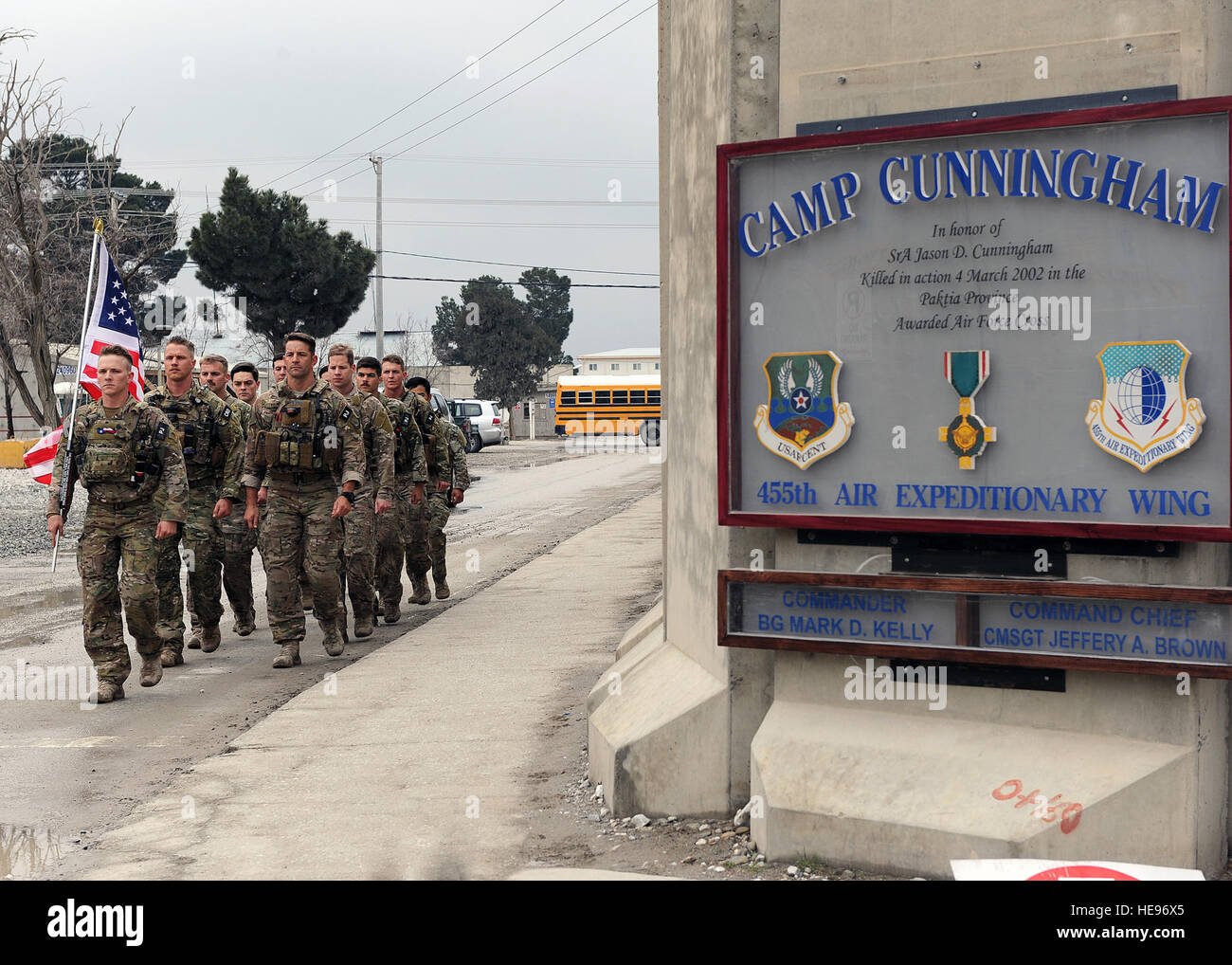 A multiservice formation of special operators marches with a U.S. flag ...