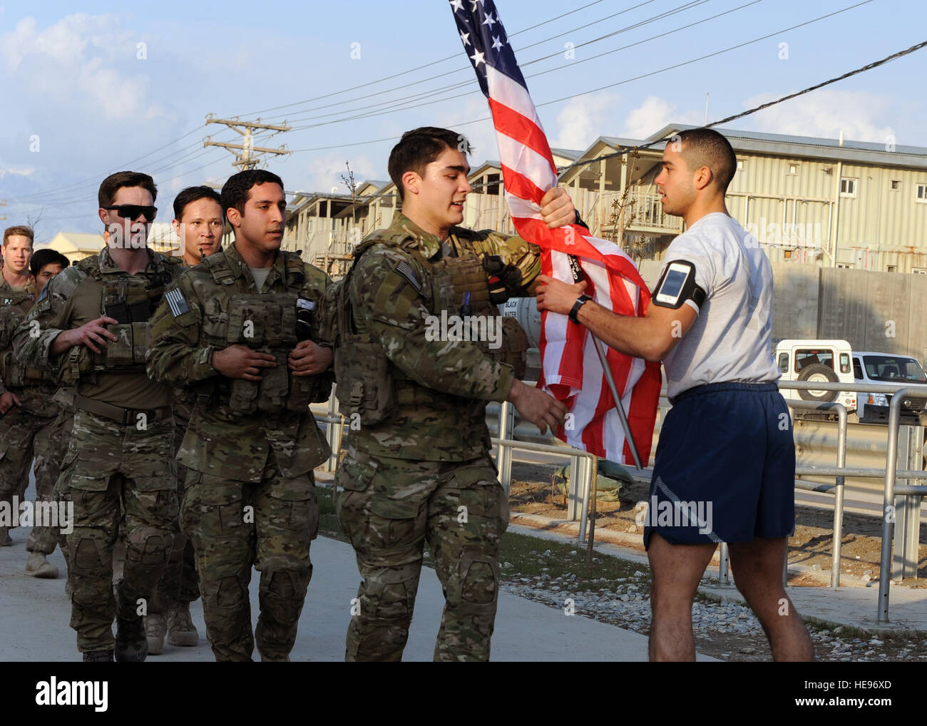 A multiservice formation of special operators passes a U.S. flag ...