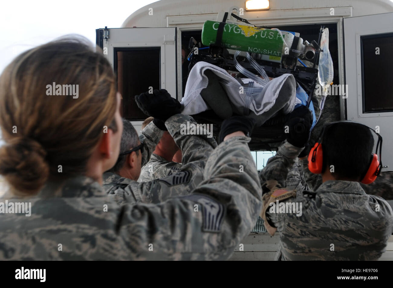 Personnel from the 332nd Expeditionary Medical Group load a patient ...