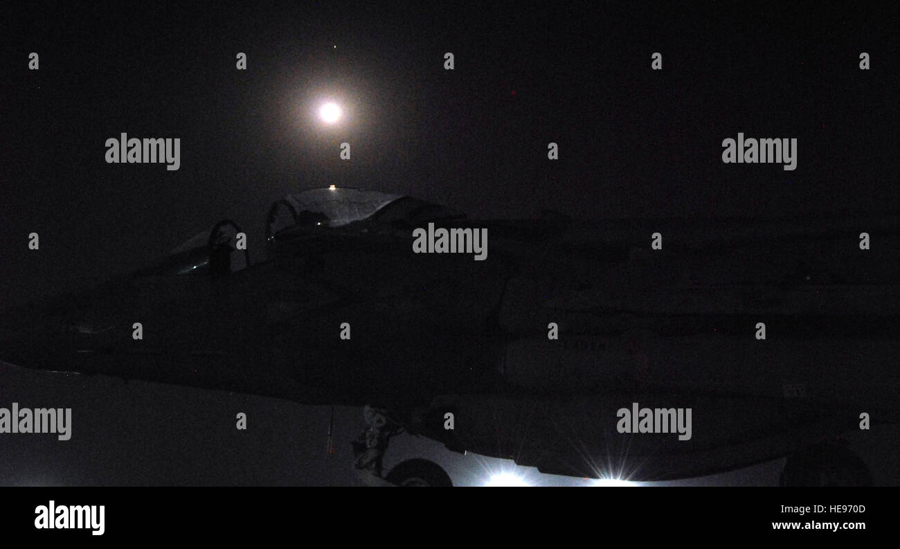 JOINT BASE BALAD, Iraq -- Reflected moonlight gleams off the cockpit of ...