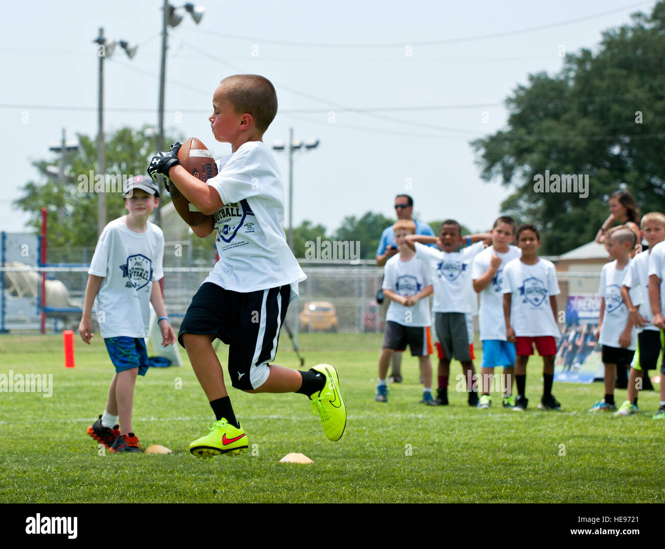 A player makes a catch during the two-day children’s football camp June ...